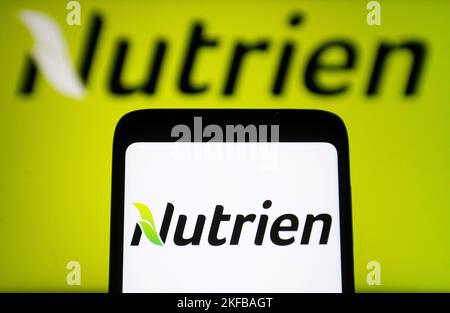 In this photo illustration, the Nutrien logo is seen displayed on a ...
