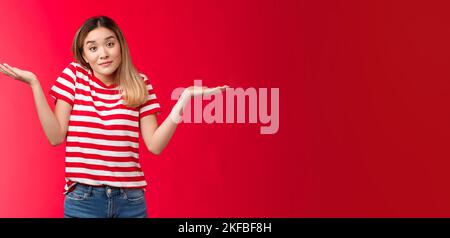 Portrait unbothered relaxed chill blond girl shrugging hands spread ...