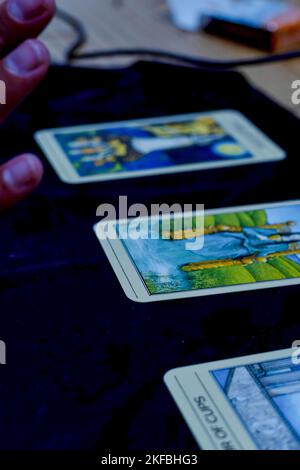 friends sharing tarot cards on a wooden table, guadalajara Stock Photo ...