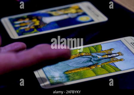 young man reading tarot cards in a meeting with his friends, mexico ...
