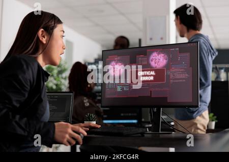 Hacked system alert message flashing on computer screen, showing security breach error and cyber ...