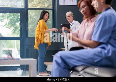 Nurse measuring insulin level and glucose in blood sample using ...