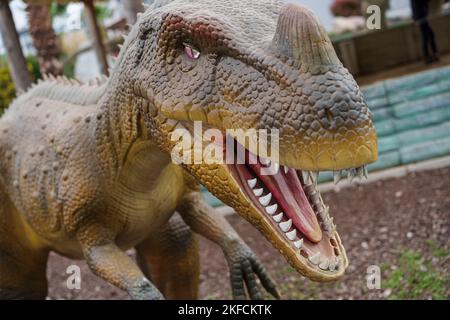 Rubber statue of a ferocious raptor dinosaur Stock Photo - Alamy
