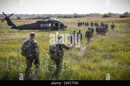 Soldiers in the communication center in Camp Able Sentry respond to a ...