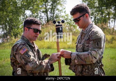 U.S. Army Soldiers set up a VS17/GVX Signal Panel while attending ...