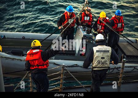 US Navy During a man overboard drill, search and rescue (SAR) swimmer ...