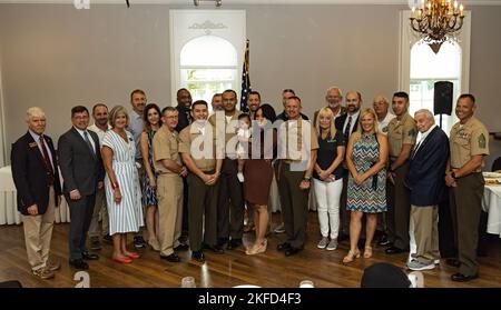 U.S. Marine Cpl. Austin Crooks (center), an administrative specialist ...