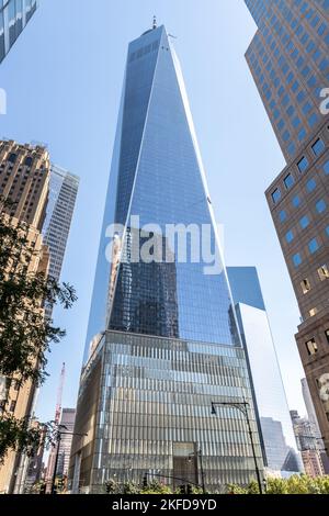 The famous Freedom Tower and buildings around blue sky Stock Photo - Alamy