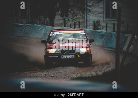 A vintage racing car surrounded by dust and smoke at the Zabra Rally in ...