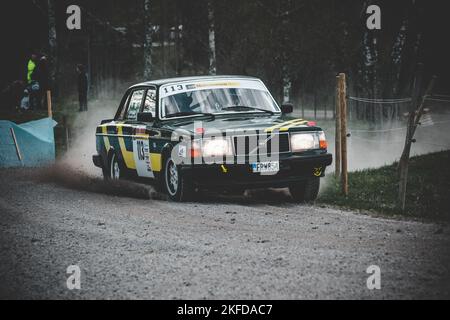 A vintage racing car surrounded by dust and smoke at the Zabra Rally in ...