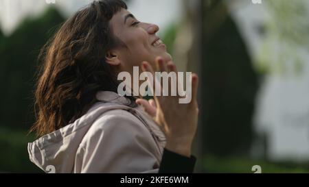 Evangelical South American woman standing outside feeling the presence ...