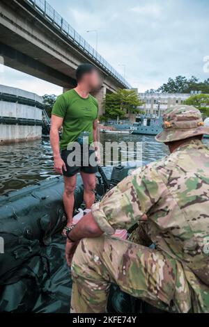A Brazilian special operations team member chambers a round during the ...
