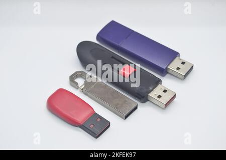 Flash drives, many shapes, old condition, placed on a white background ...