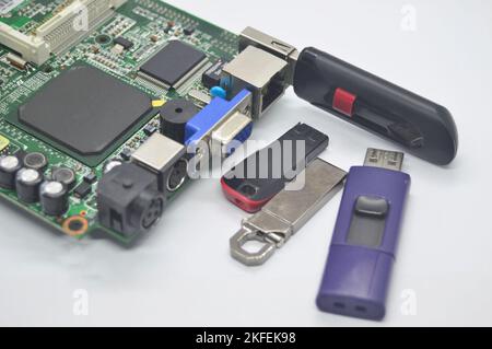 Flash drives, many shapes, old condition, placed on a white background ...