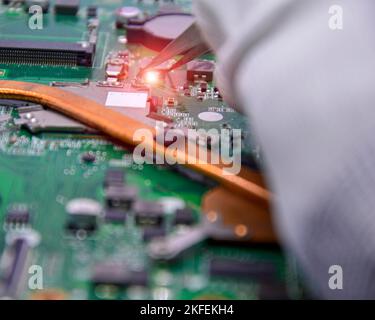 Disassembling computer motherboard closeup Stock Photo - Alamy