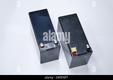 2 batteries placed on a white background (old batteries Stock Photo - Alamy