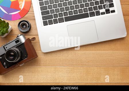 Photographer's desk made of wood with a camera and palettes. High ...