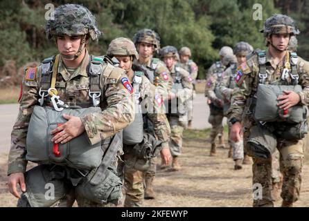 A formation of aircraft of the 82nd Airborne Division fly over a pass ...