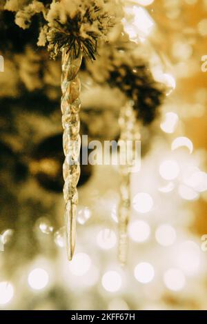 Icicles hanging on a Christmas tree close-up. A decor concept for ...