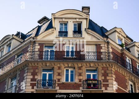 The facades of a modernized medieval building before the blue sky in ...