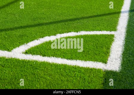 Close-up of the goal and touchline of a brand new football stadium ...