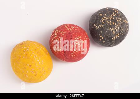 Colorful seasoned bread resting on a white background Stock Photo - Alamy
