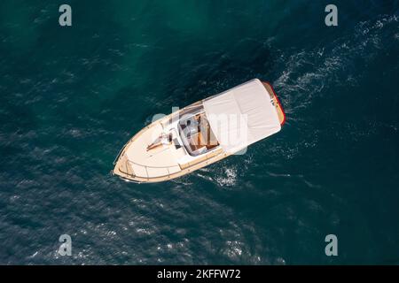 Top view of sailing luxury yacht at opened sea at sunny day in Croatia ...