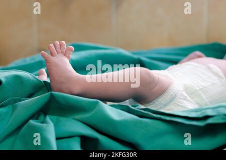 A newborn baby who is being cleaned up after birth Stock Photo - Alamy