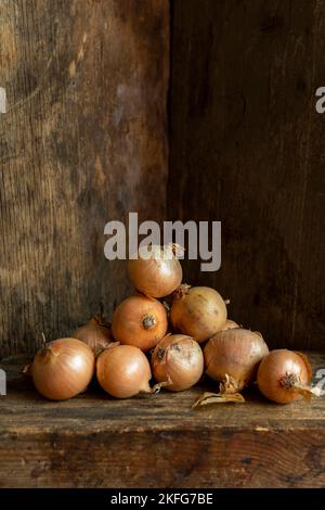 Onion harvest stacked in wooden basket boxes in Mediterranean area ...