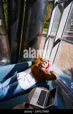 Pretty woman taking a break between work Stock Photo - Alamy