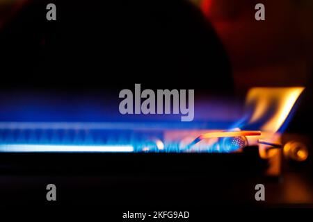 Gas boiler igniter. Gas is burning in the boiler Stock Photo - Alamy