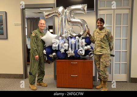 Col. Joseph Janik and Chief Master Sgt. Rosiline Ratliff poses by the ...