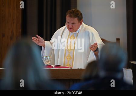 Father Filip Wodecki reads text to the Hanscom Air Force Base chapel ...