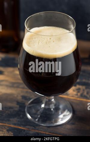 Boozy Cold Craft Porter Stout Beer in a Footed Glass Stock Photo - Alamy