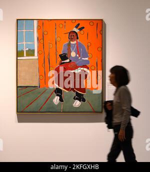A museum visitor admires a painting by Native-American artist T.C ...