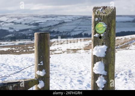 Rossendale Way footpath marker on a fence post in the snow on the ...