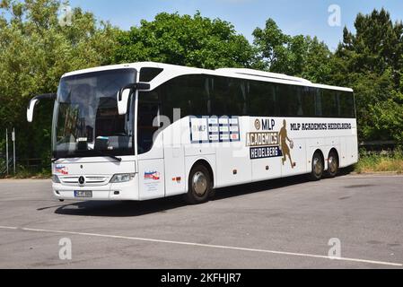 White Mercedes-Benz Tourismo coach bus on road on a beautiful day of ...