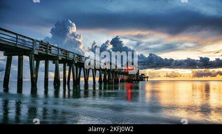 The beautiful Old Naples Pier over water in Florida at sunset Stock ...
