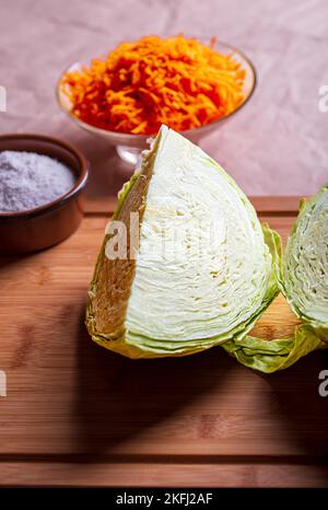 Prepare cabbage for fermentation. Cutting of cabbage on cutter ...