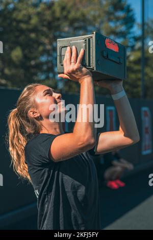 A member of Harvard University’s field hockey team conducts the buddy ...