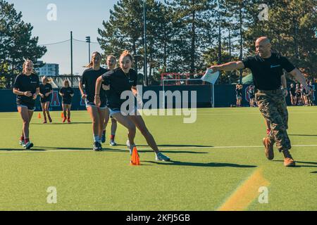 A member of Harvard University’s field hockey team conducts the buddy ...