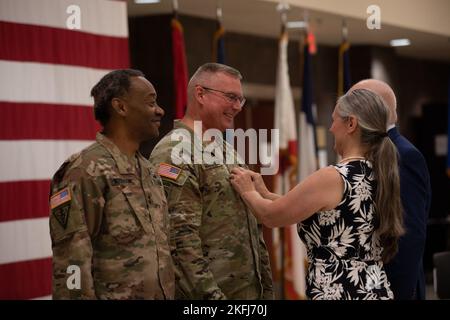 Maj. Gen. Joseph A. Marsiglia smiles as he receives the colors during a ...