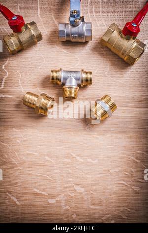 Brass Pipe Connectors On Wooden Board Stock Photo - Alamy