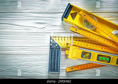Wooden meter construction level square ruler on white board Stock Photo ...