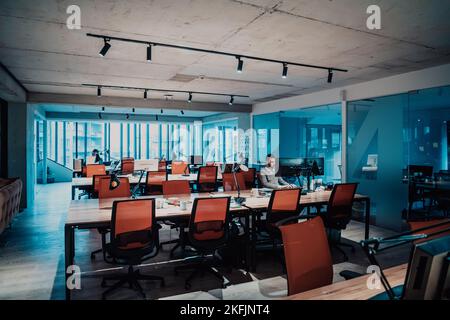 Portrait professional engineer smiles and looks in computers working ...