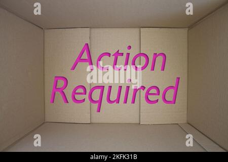 Action Required word with cardboard box. Brown folded card box Stock ...