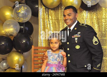 Staff Sgt. William Stephens and his daughter pose for photo booth ...