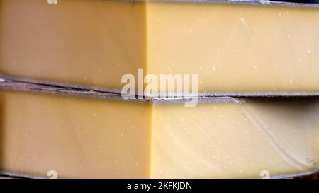 Large wedges of Comte cheese at a cheesemonger stall at a food market ...