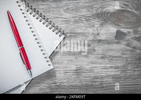 Note books biro pen on wooden board education concept Stock Photo - Alamy
