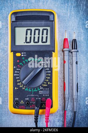 Digital electrical tester on metallic background electricity concept ...